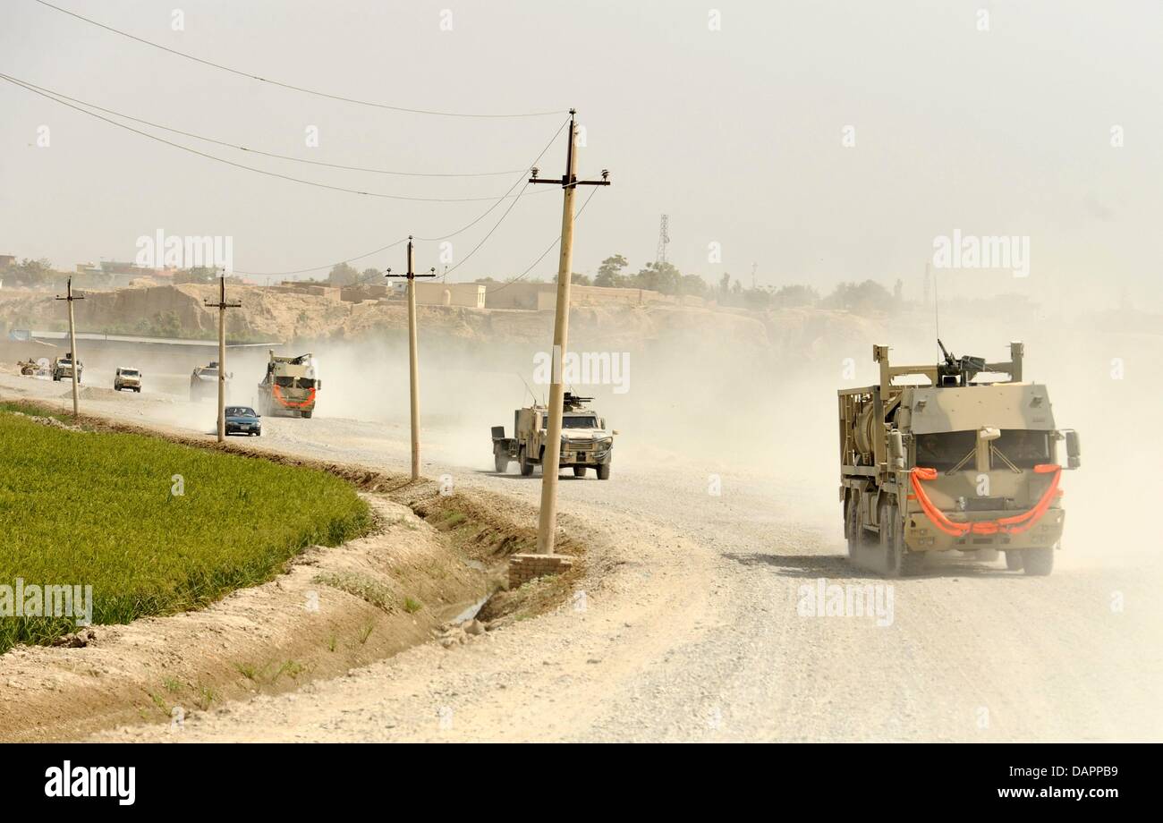 A German Bundeswehr logistic convoy rides to an outpost near Kundus ...