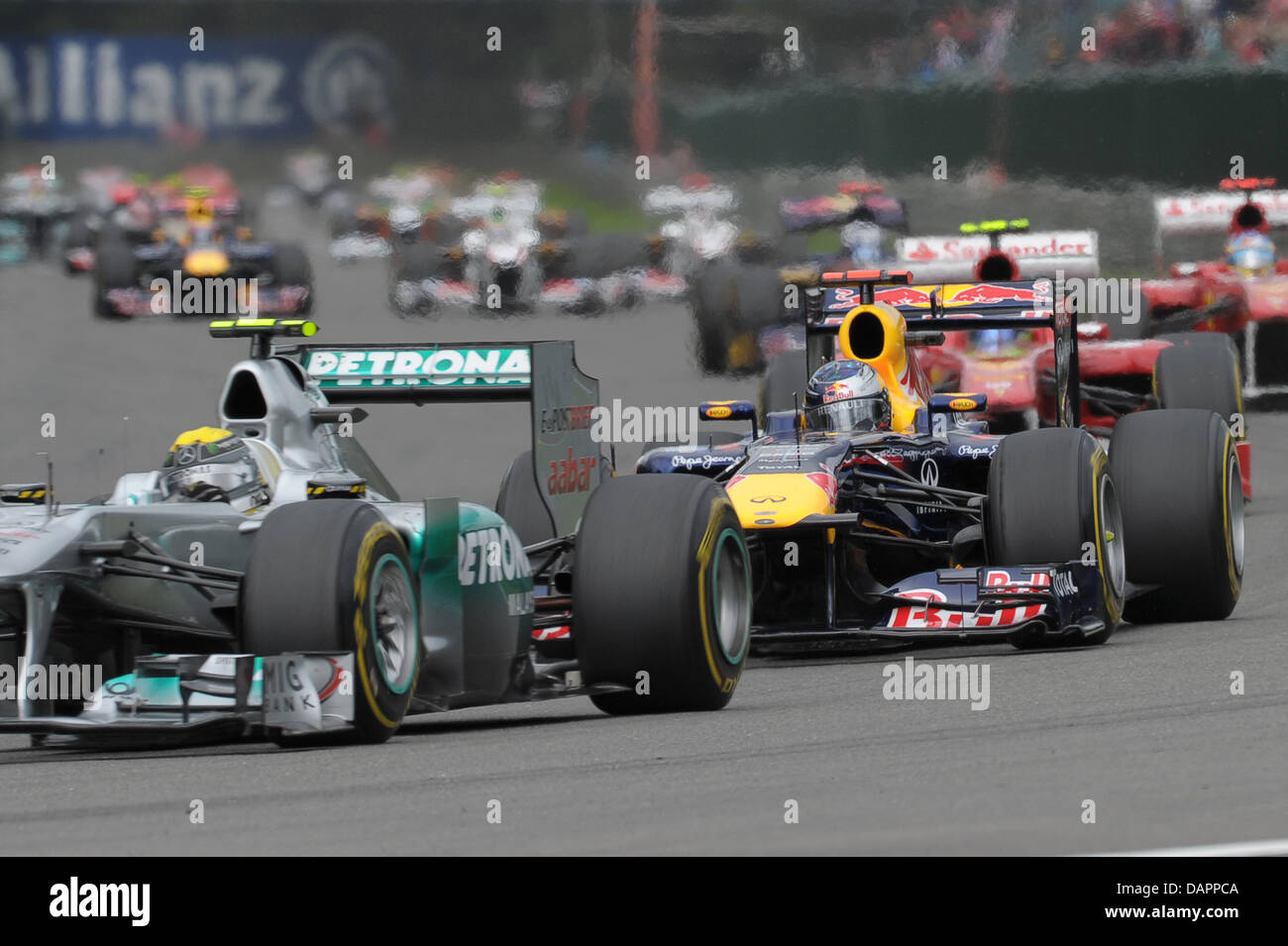 German Formula One driver Nico Rosberg (L) of Mercedes GP overtakes ...