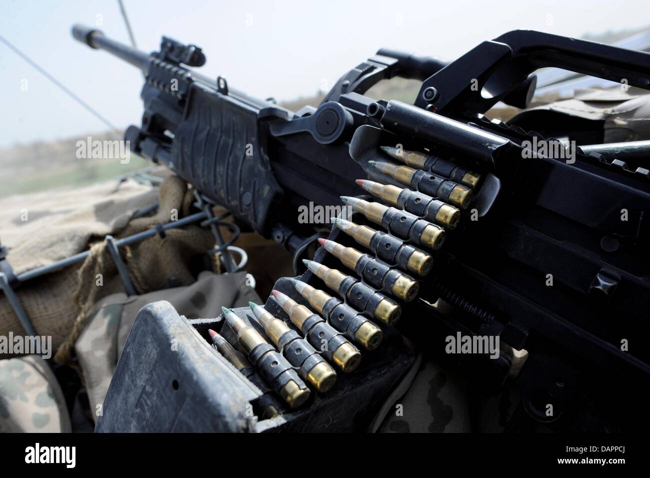 A MG4 machine gun is part of a convoy to an outpost near Kundus ...