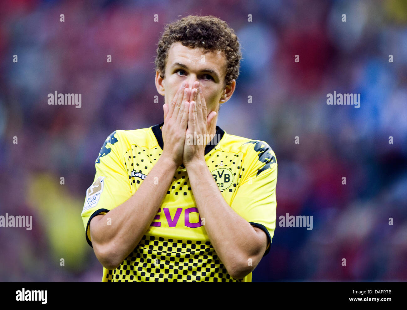 Dortmund's Ivan Perisic grabs his face during the German Bundesliga ...