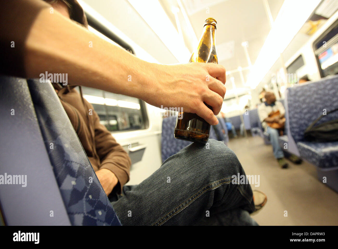 ILLUSTRATION - A man drinks a beer inside a subway in Hamburg, Germany ...