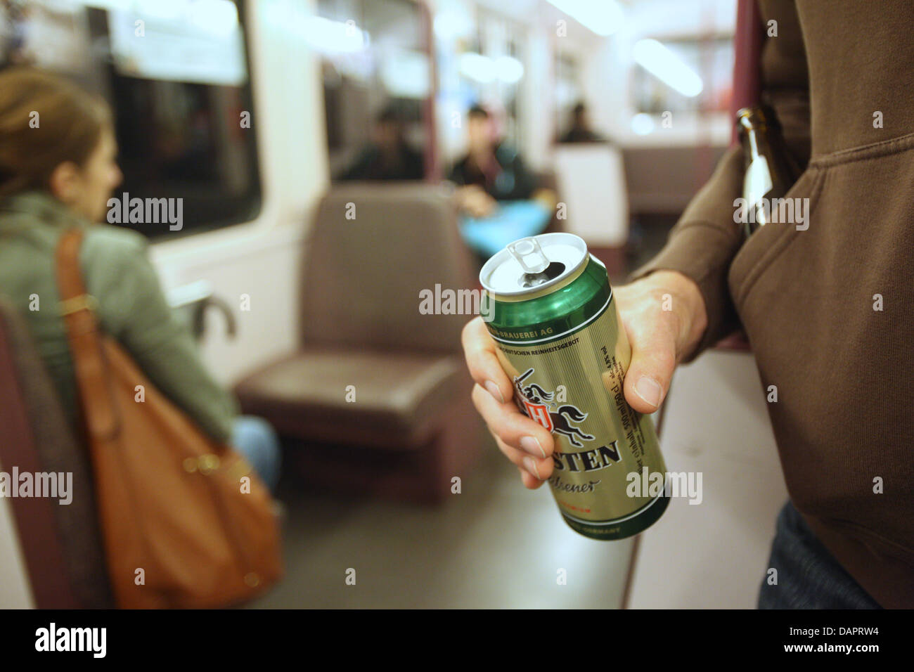 ILLUSTRATION - A man drinks a beer inside a subway in Hamburg, Germany ...