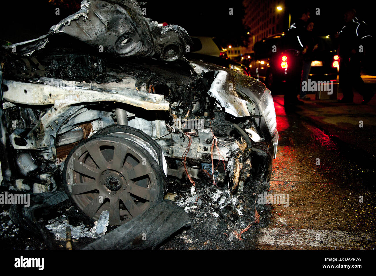 A burnt out Mercedes stands at Jacoby street in Berlin, Germany, 30 ...