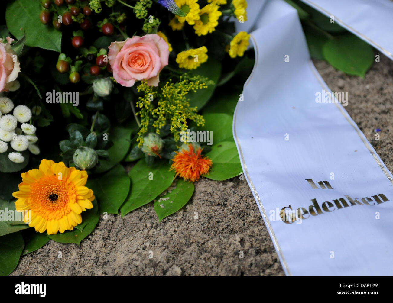 Flowers lay on the grave of German humorist Loriot at Waldfriedhof in ...