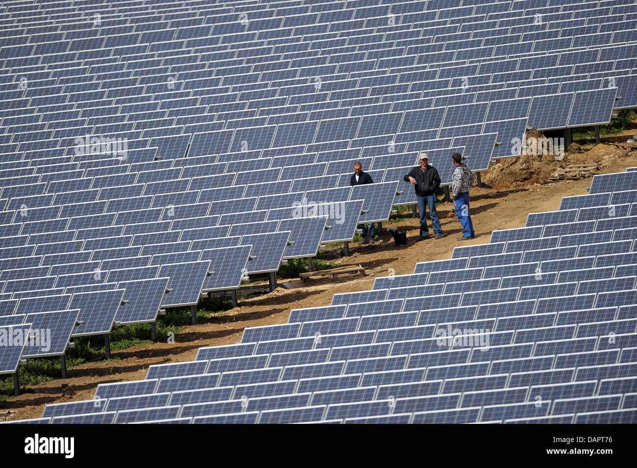 Workers stand at the construction site of the Solar Park in Fesselsdorf ...