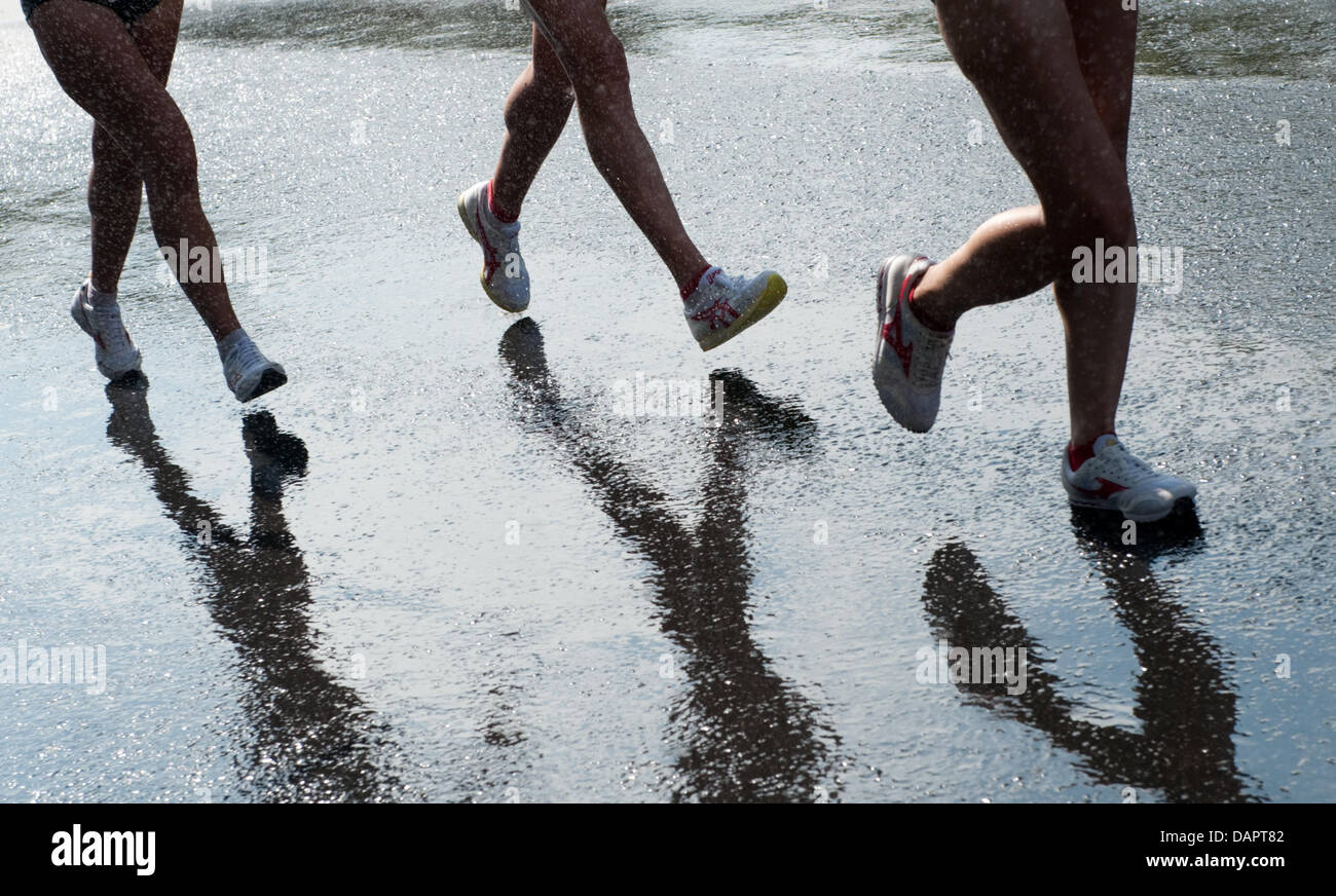 Runners compete in the women's 20km Walk in downtown Daegu at the 13th ...