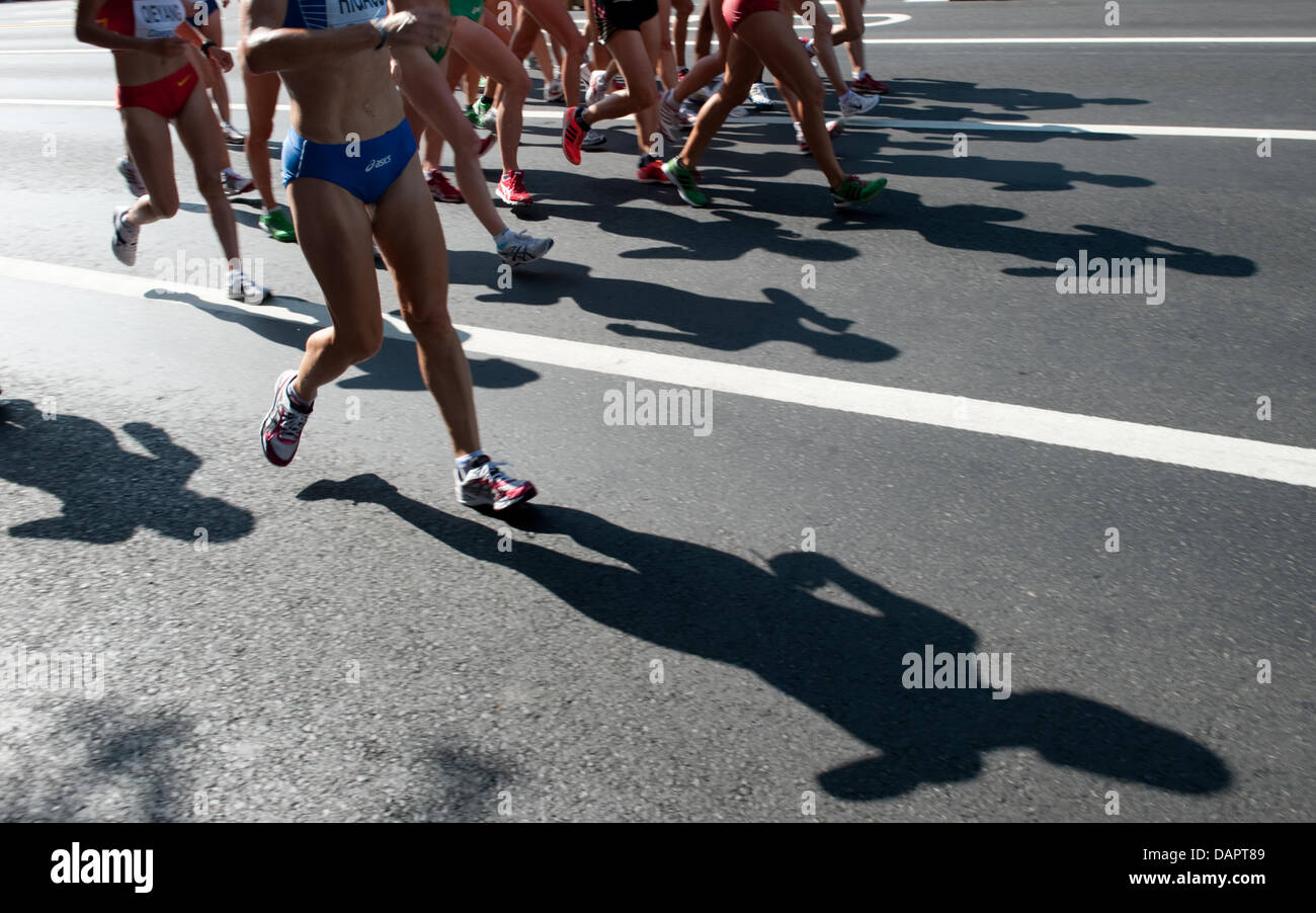 Runners compete in the women's 20km Walk in downtown Daegu at the 13th ...