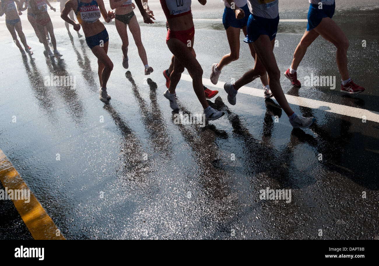 Runners compete in the women's 20km Walk in downtown Daegu at the 13th ...