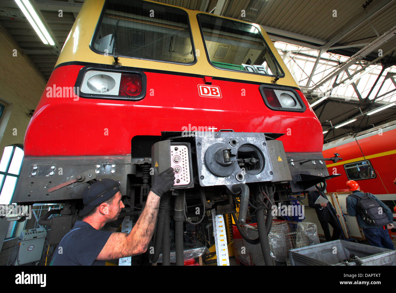 A mechanic works on a Berlin suburban railways train in Wittenberge ...