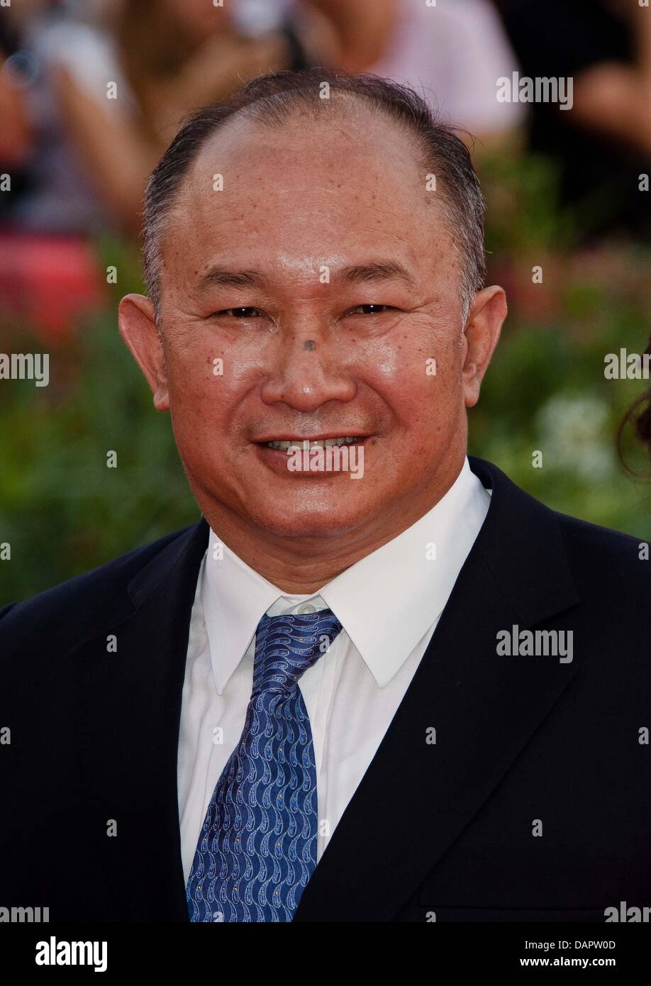 Director John Woo arrives at the premiere of 'The Ides Of March' during ...