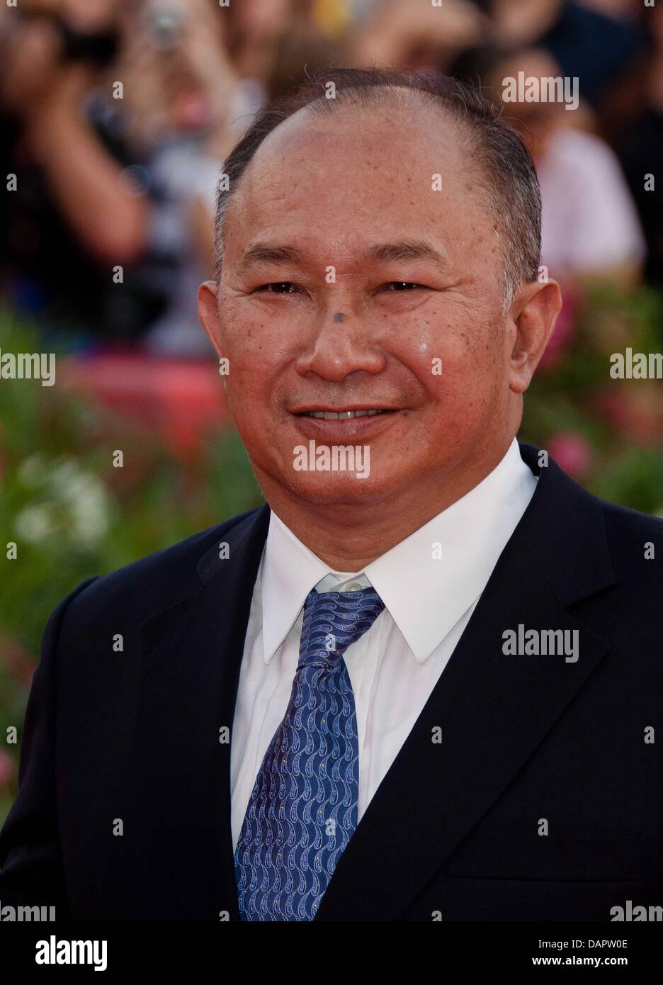 Director John Woo arrives at the premiere of 'The Ides Of March' during ...
