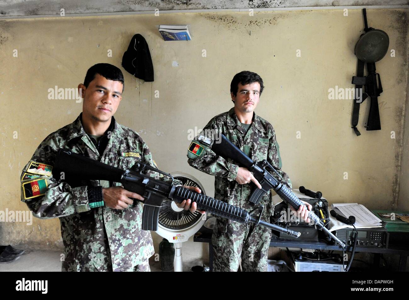 Soldiers of the Afghan National Army ANA stand inside their camp in ...