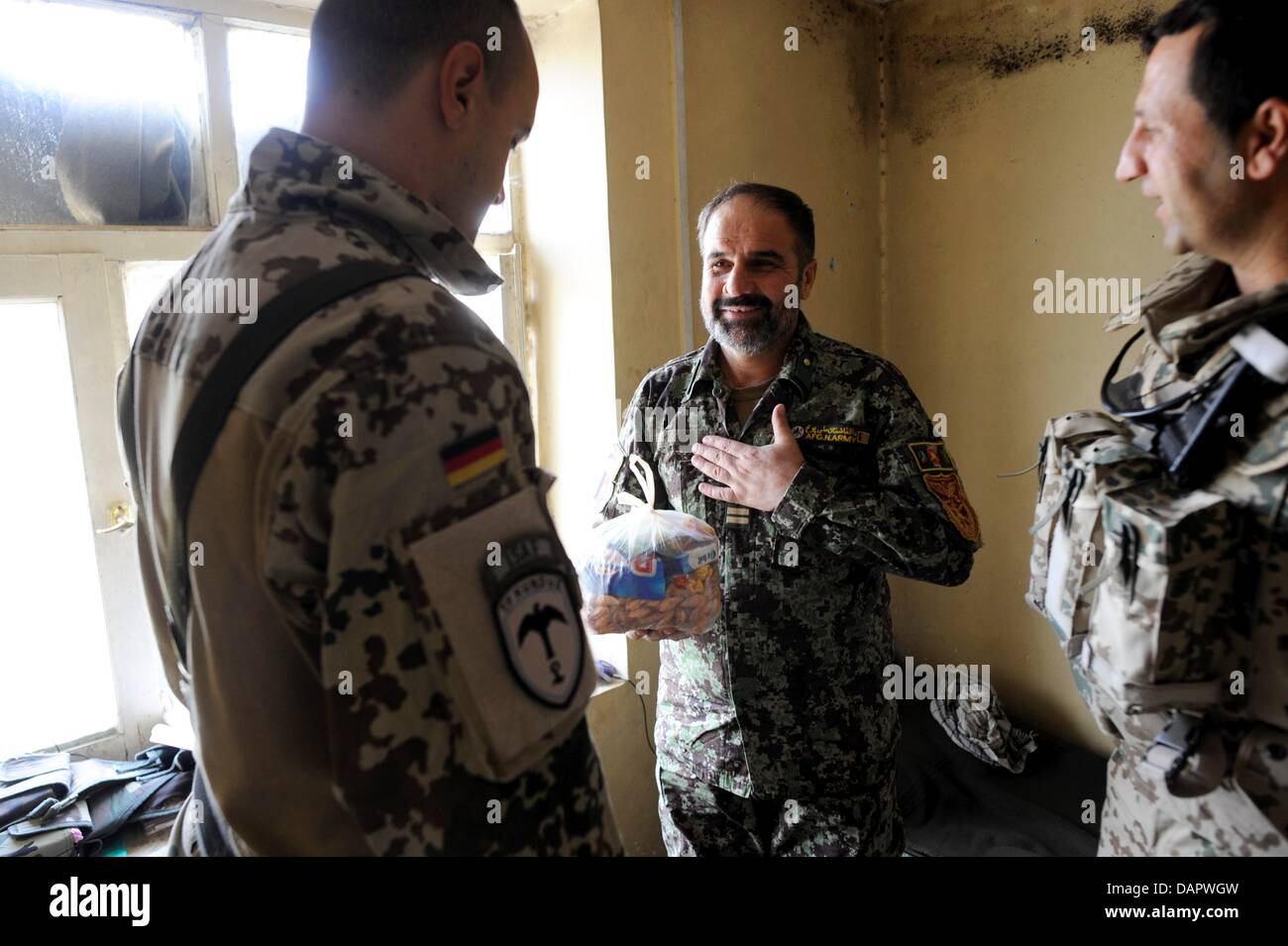 German Armed Forces soldiers and the captain of the Afghan National ...
