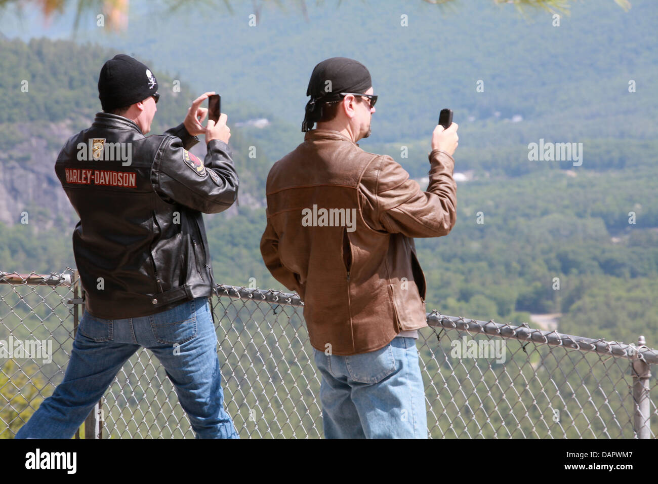 Two men photograph the view on top of the Cathedral Ledge in North ...