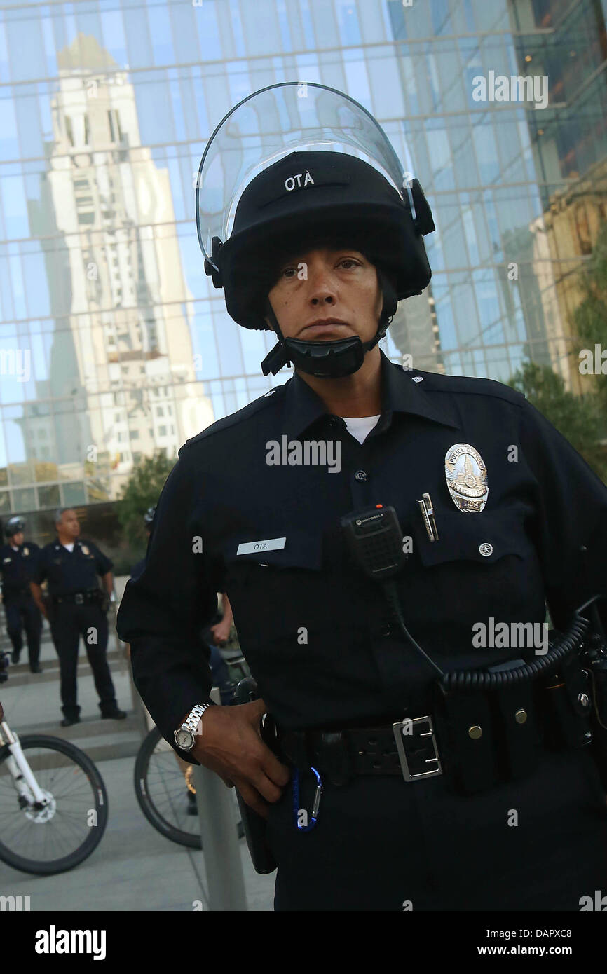 Los Angeles, CA, USA. 16th July, 2013. Riot police stand at the ready ...