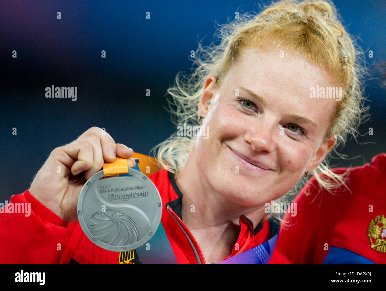 Betty Heidler of Germany shows her silver medal in the women's Hammer ...