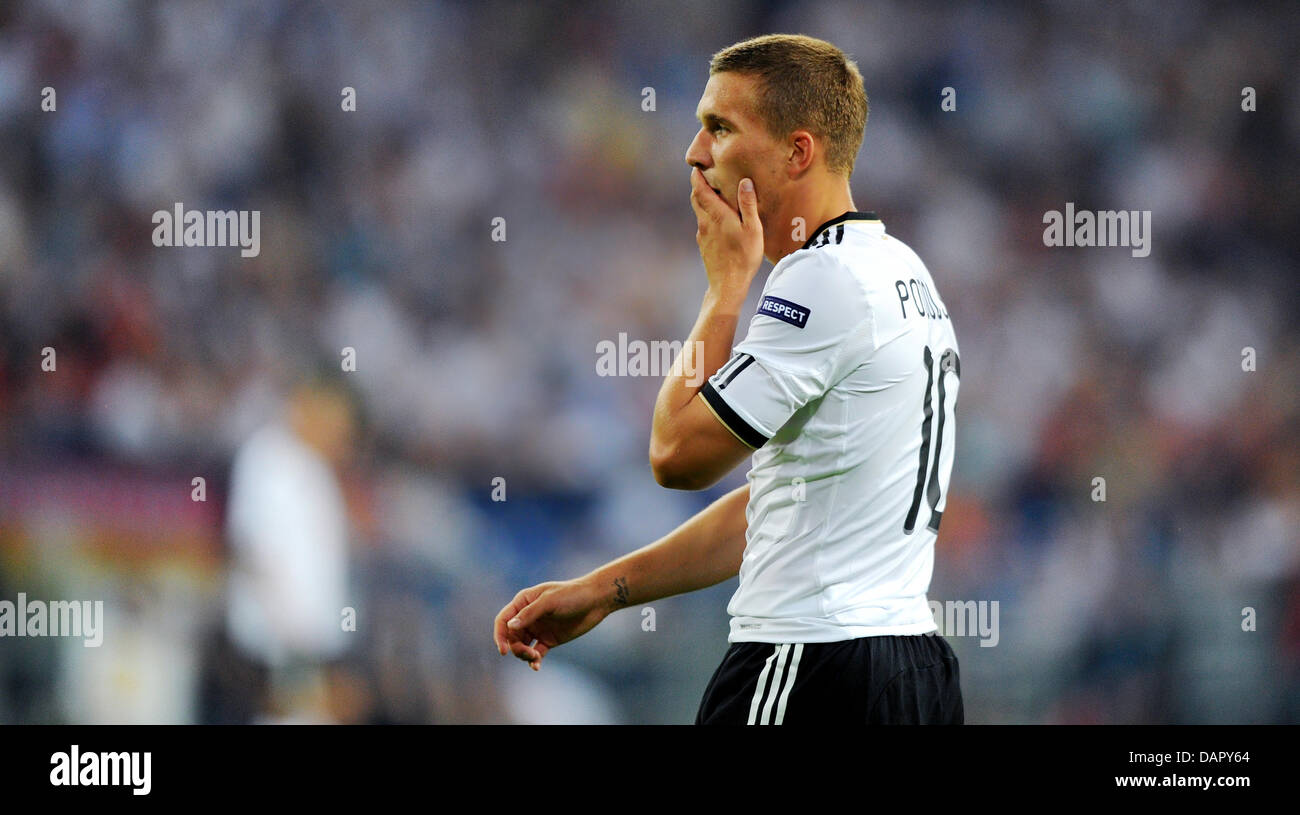 Germany's Lukas Podolski grabs his face during the EURO 2012 group A ...