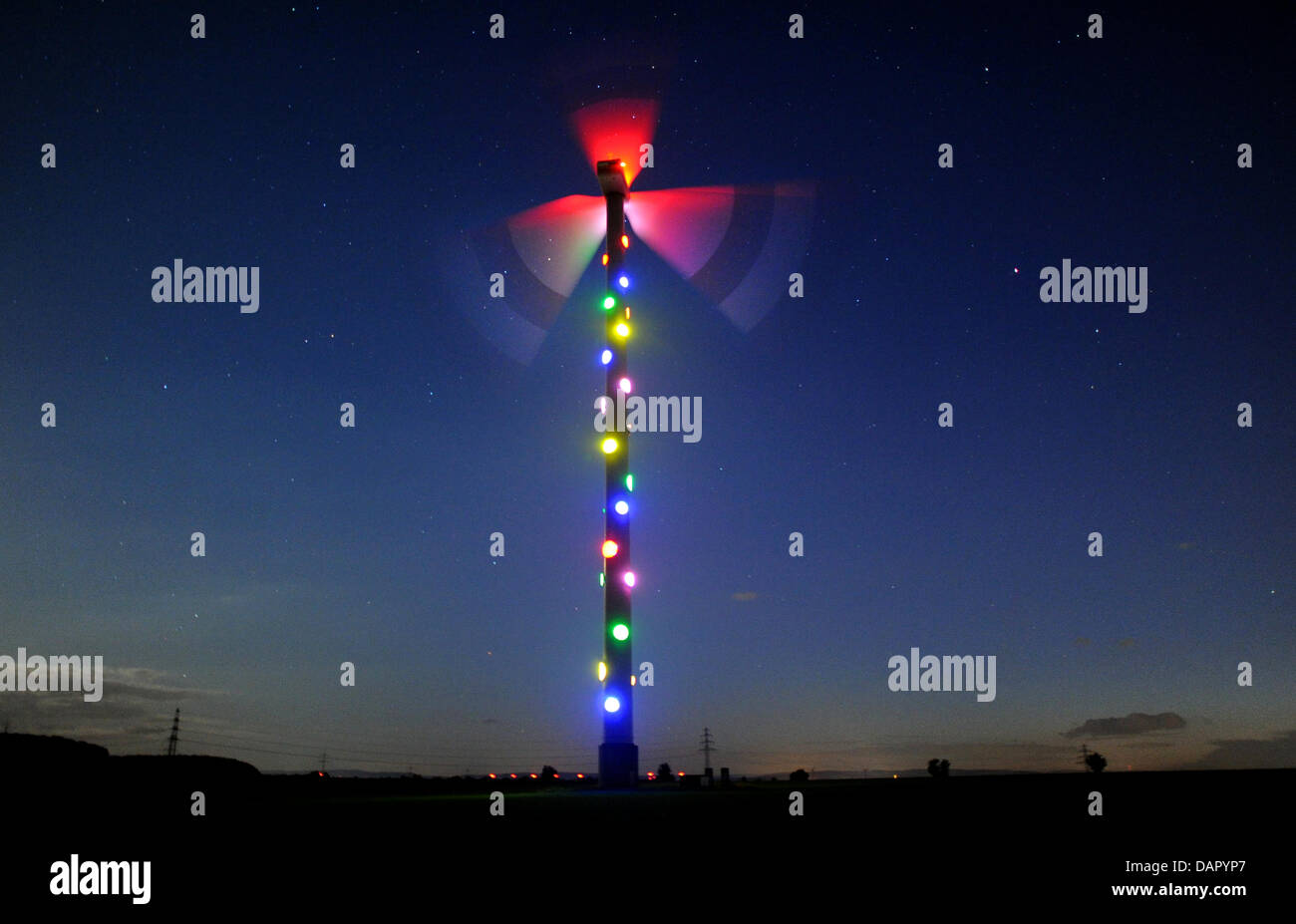 An wind turbine with colorful lights on it from the Windwaerts Energie ...