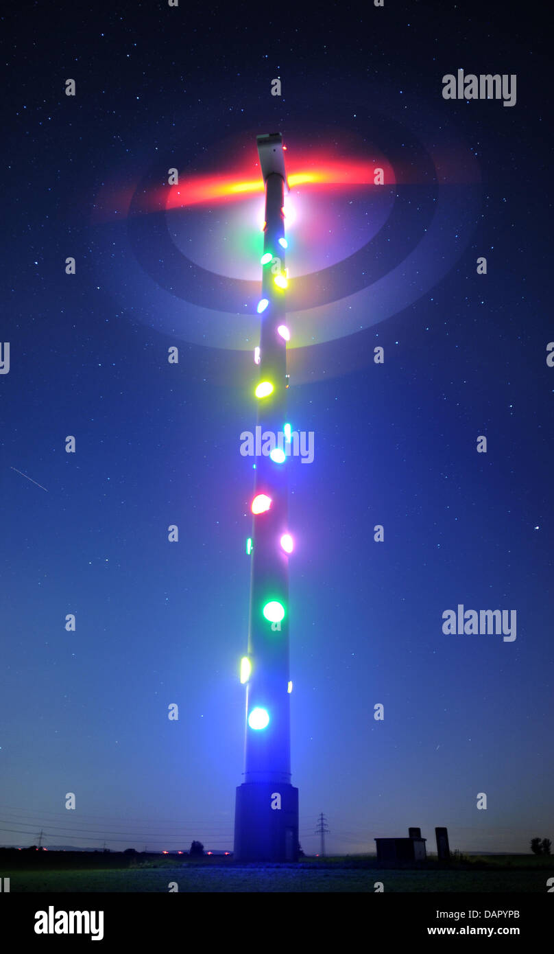 An wind turbine with colorful lights on it from the Windwaerts Energie ...