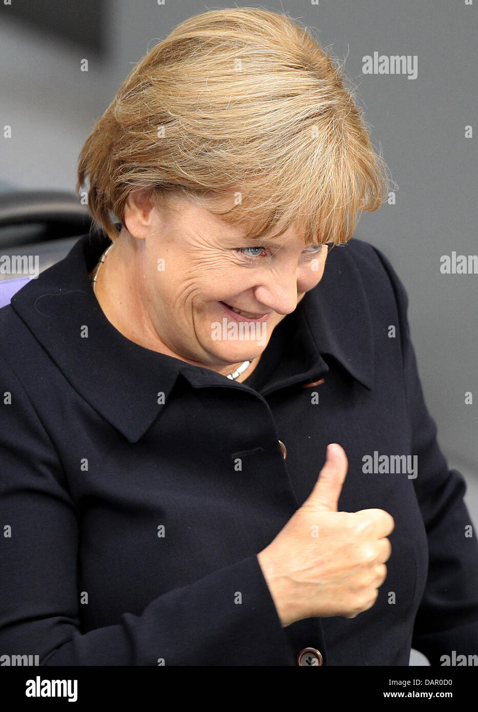 German Chancellor Angela Merkel smiles with a thumbs up during a ...