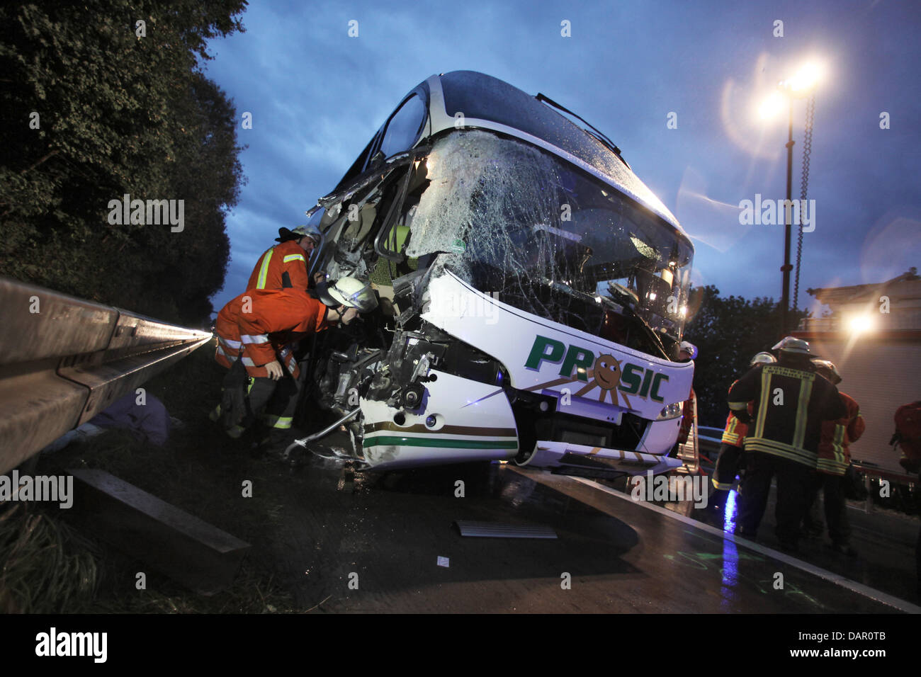 Fire fighters inspect a bus met with an accident on Autobahn A5 near ...