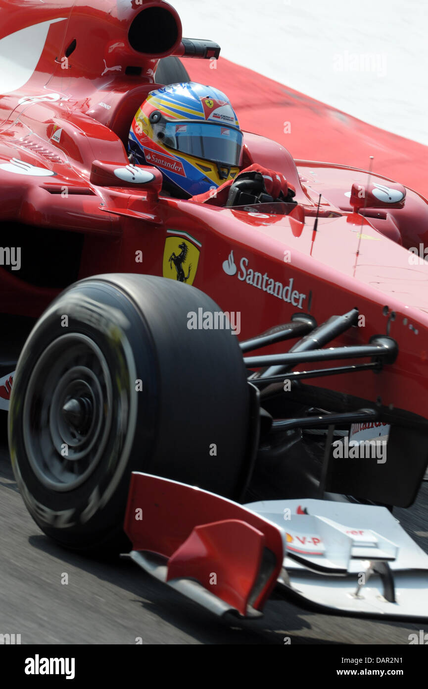 Spanish Formula One driver Fernando Alonso of Ferrari steers his car ...