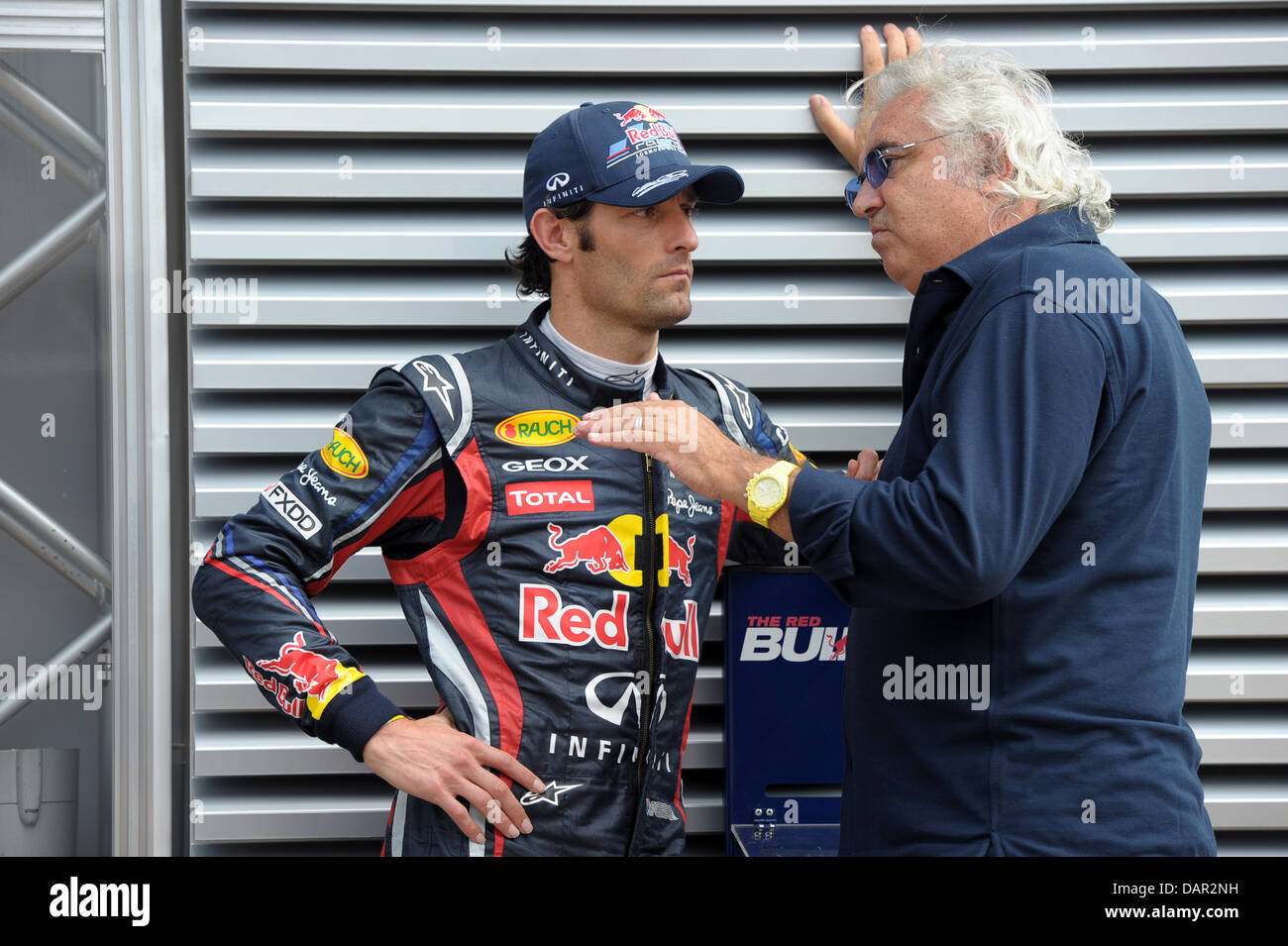 Australian Formula One driver Mark Webber (L) of Red Bull chats with ...