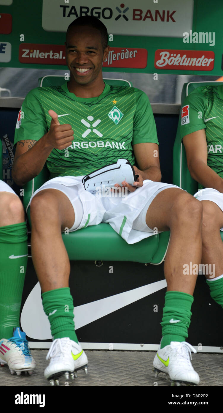Bremen's Naldo sits back down on the bench after a long injury break ...