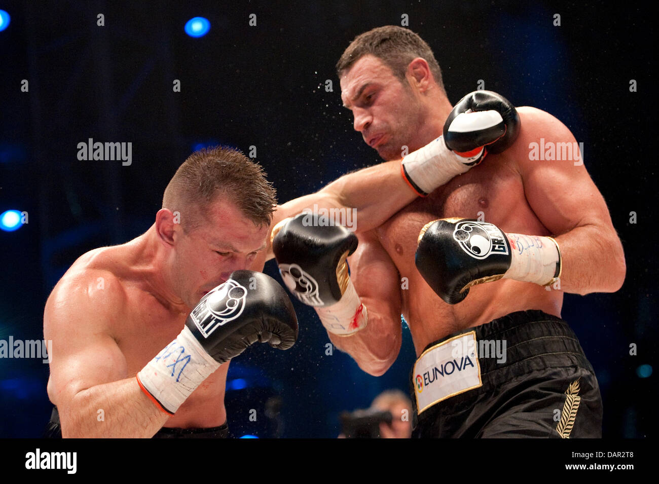 Vitali Klitschko (R) of Ukraine and Tomasz Adamek (L) of Poland fight ...