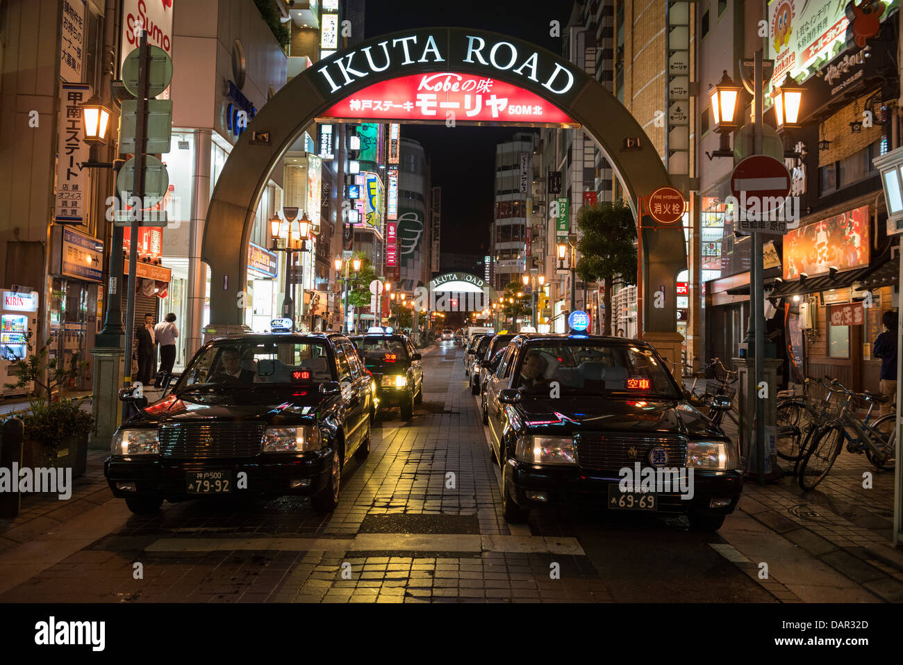 Busy Street Scene at Night in Ikuta Road, Kobe, Japan Stock Photo - Alamy