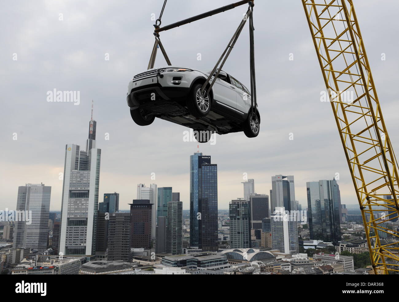 The pre-series model of a Range Rover Evoque hovers in the air in front ...