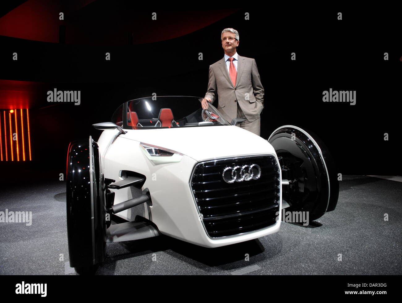 Chairman of car manufacturer Audi, Rupert Stadler, stands next to the ...