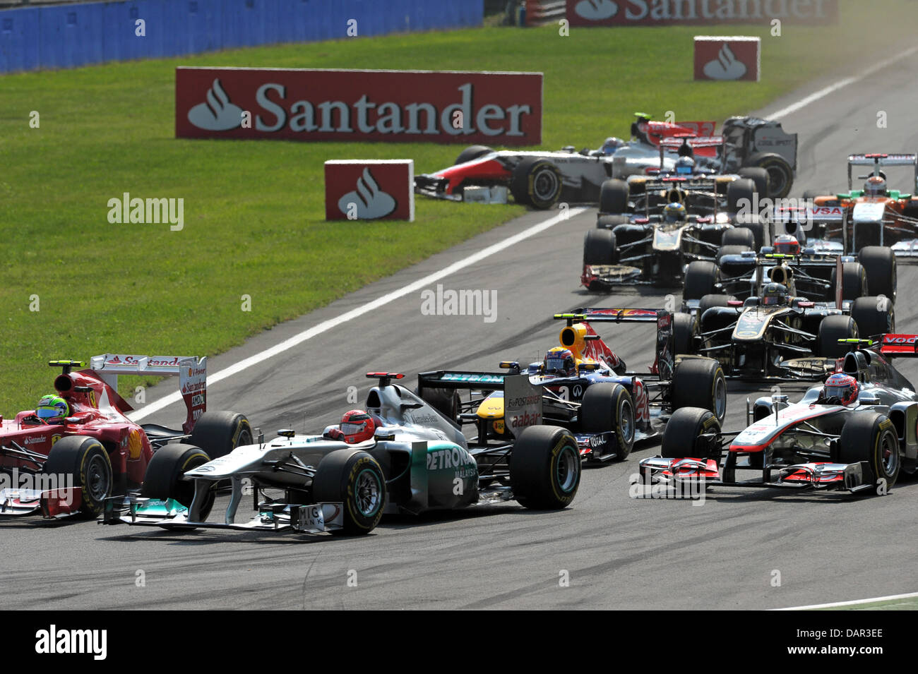 German Formula One driver Michael Schumacher (2nd L) of Mercedes GP ...