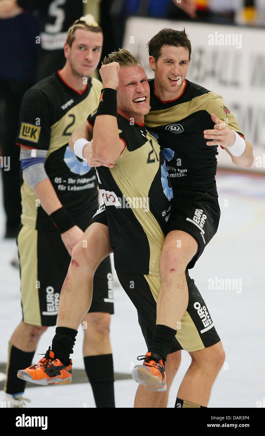 German player Pascal Hens (L-R), Lars Kaufmann and Torsten Jansen cheer ...