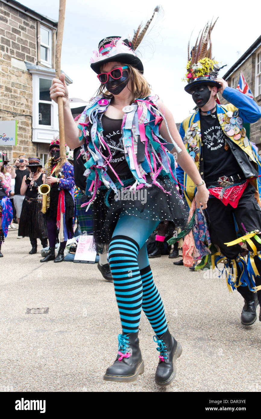 Portrait of a traditional female morris dancer with black face at the ...