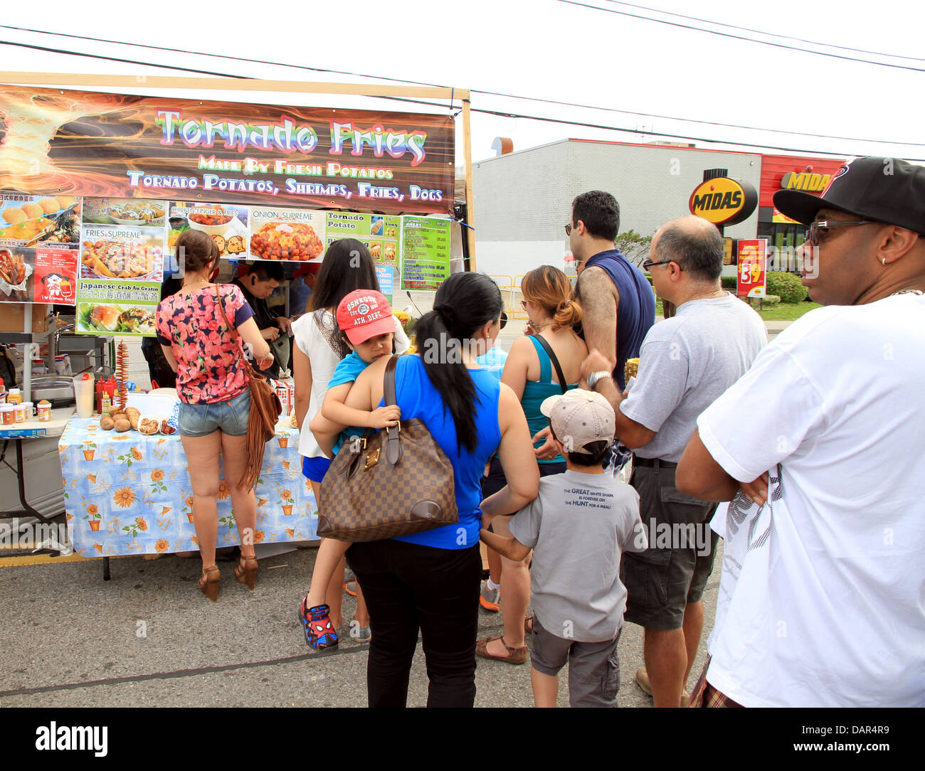 People lining up for street food at the annual Taste of Lawrence street ...