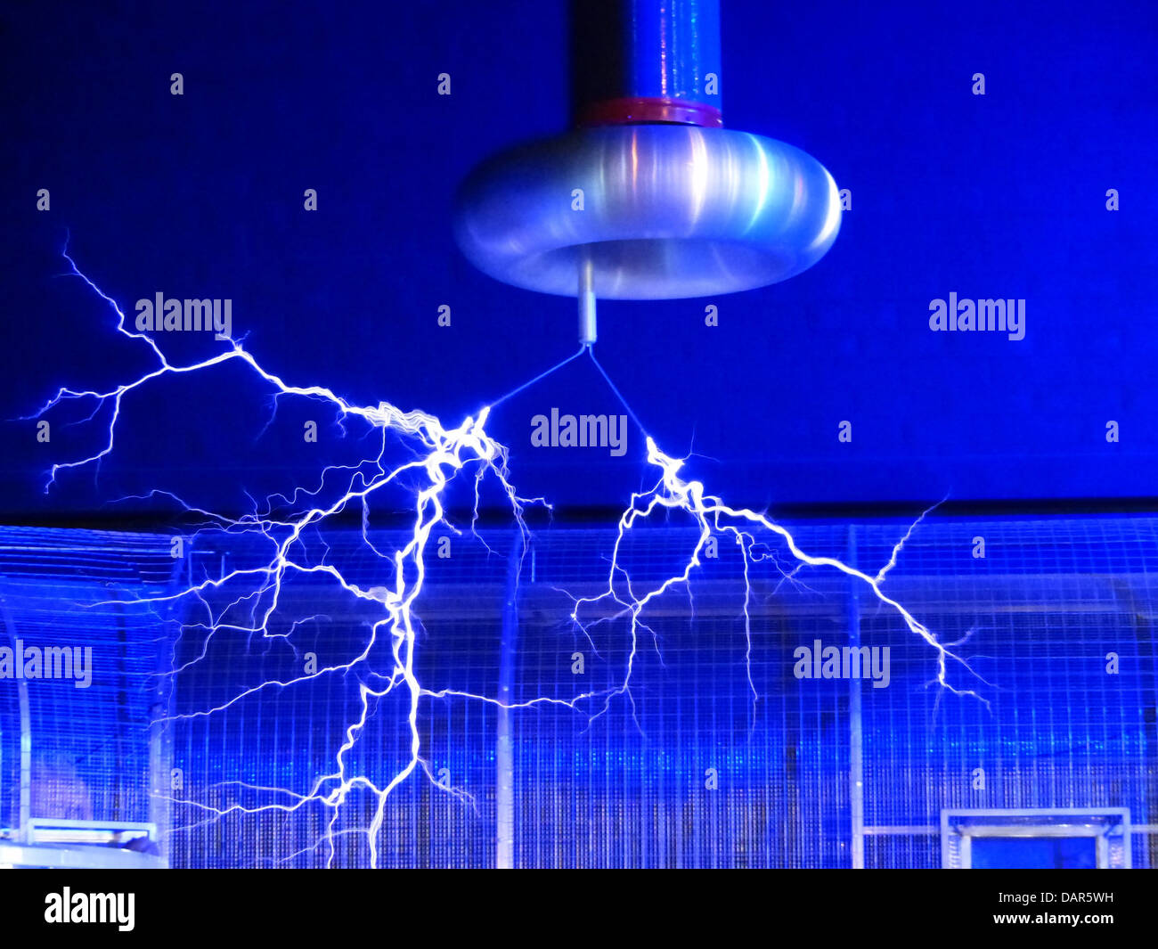 A flash Tesla coil experiment demonstrates the power of high-voltage ...