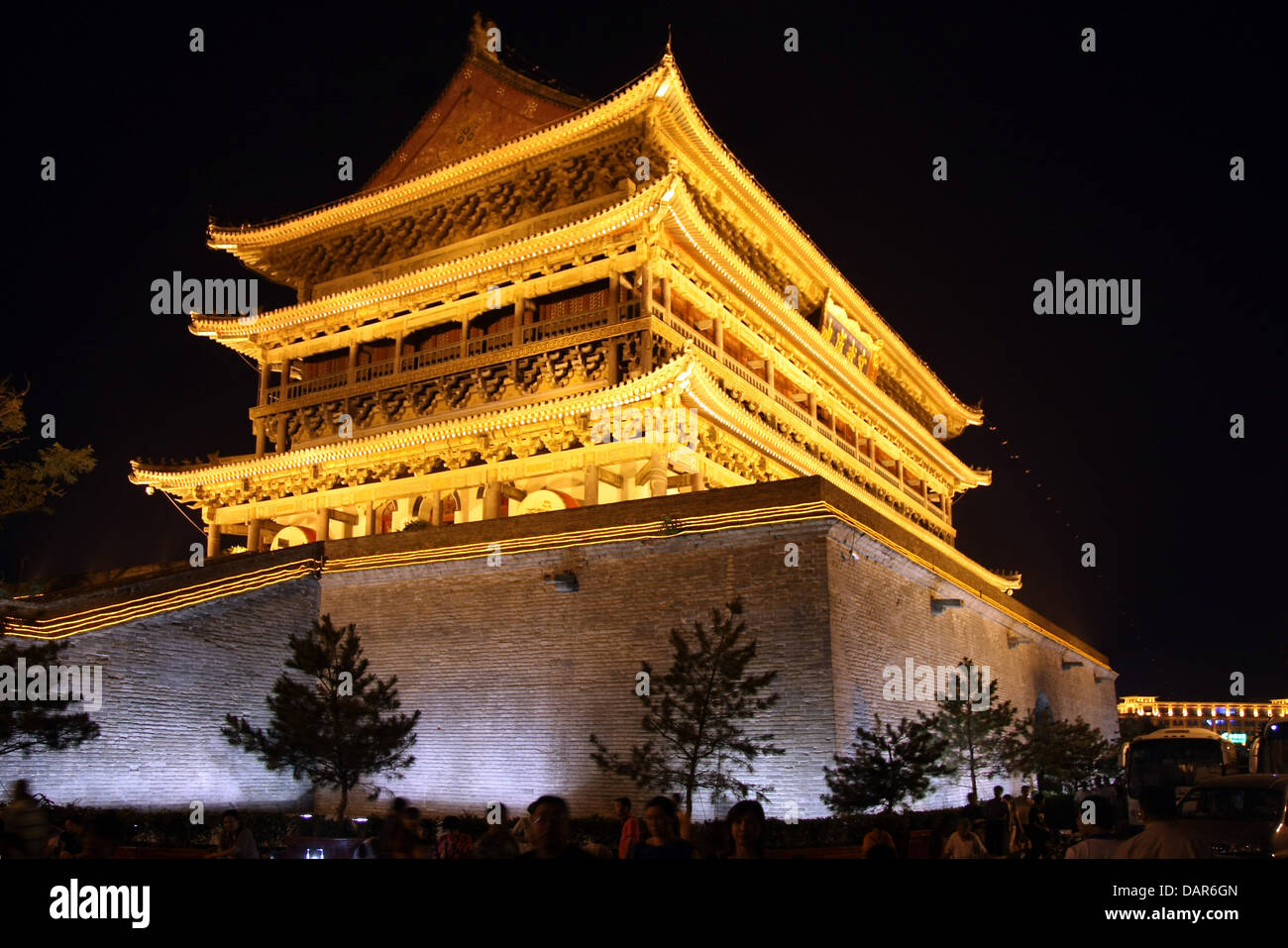 A temple building in Xian, China, illuminated by evening lights. The ...