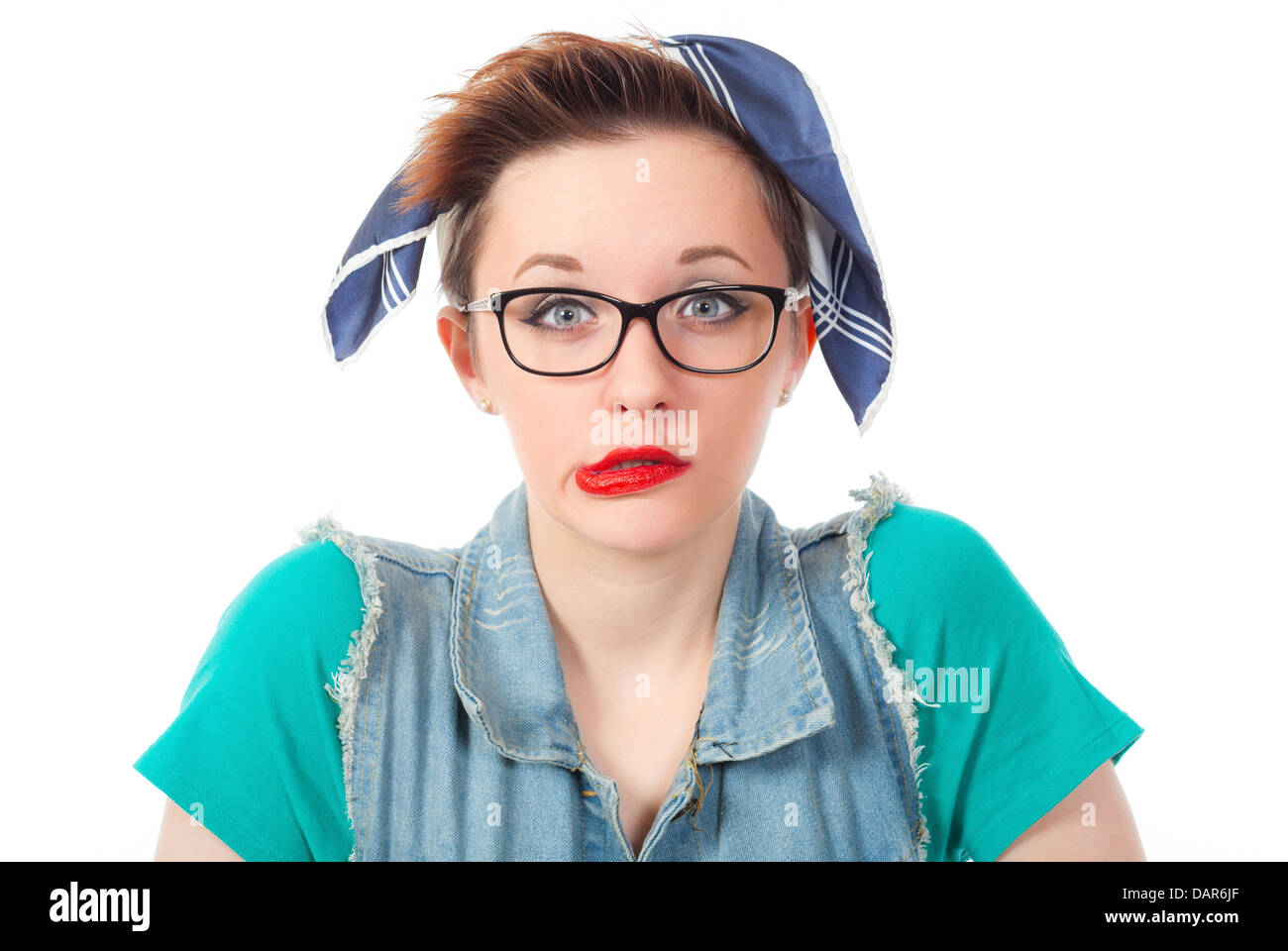 Young teenager, dressed casually and wearing glasses, a girl, makes ...