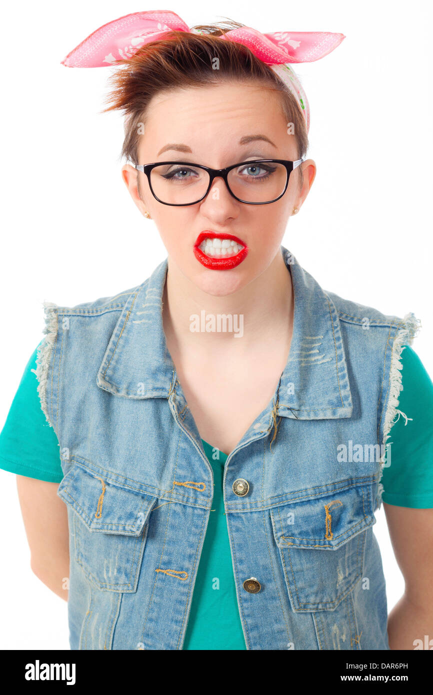 Young teenager, dressed casually and wearing glasses, a girl, makes ...