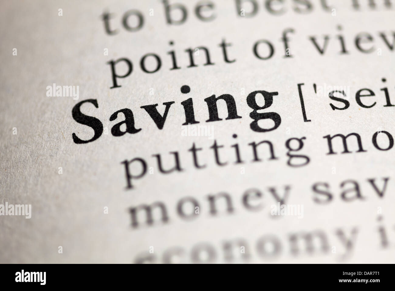 Fake Dictionary, Dictionary definition of the word Saving Stock Photo ...