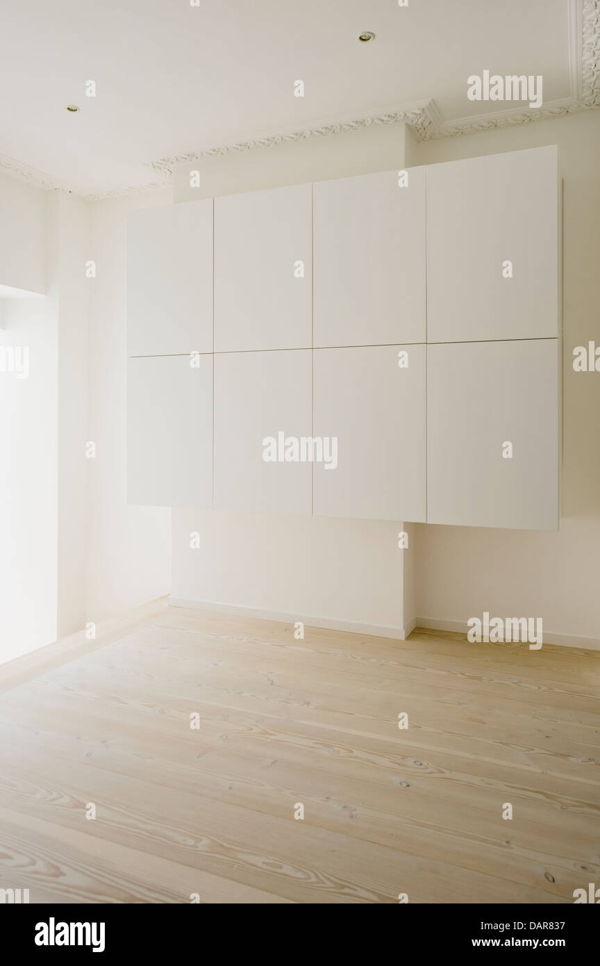 Wall mounted concealed storage unit Stock Photo - Alamy