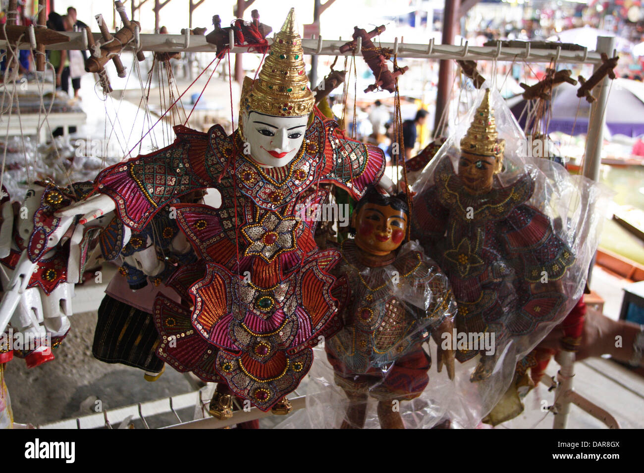 Puppets are offered for sale at Damnoen Saduak Floating Market ...