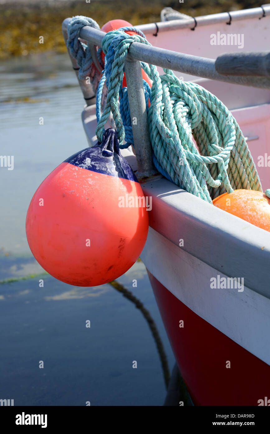 Lobster pot buoy on rails of fishing boat Stock Photo - Alamy