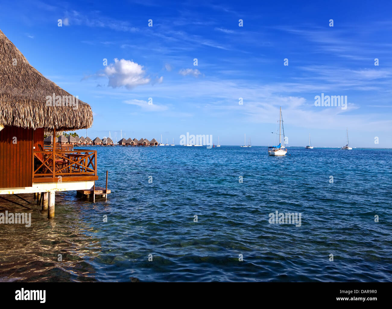 Typical Polynesian landscape -small houses on water Stock Photo - Alamy