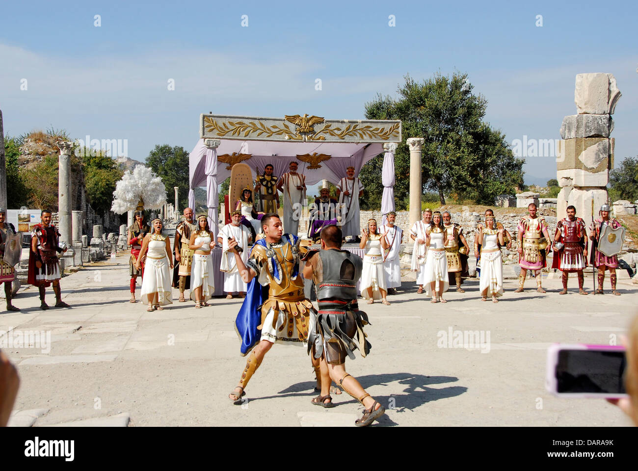 Actors recreating the Roman sport of gladiators in front of the Roman ...