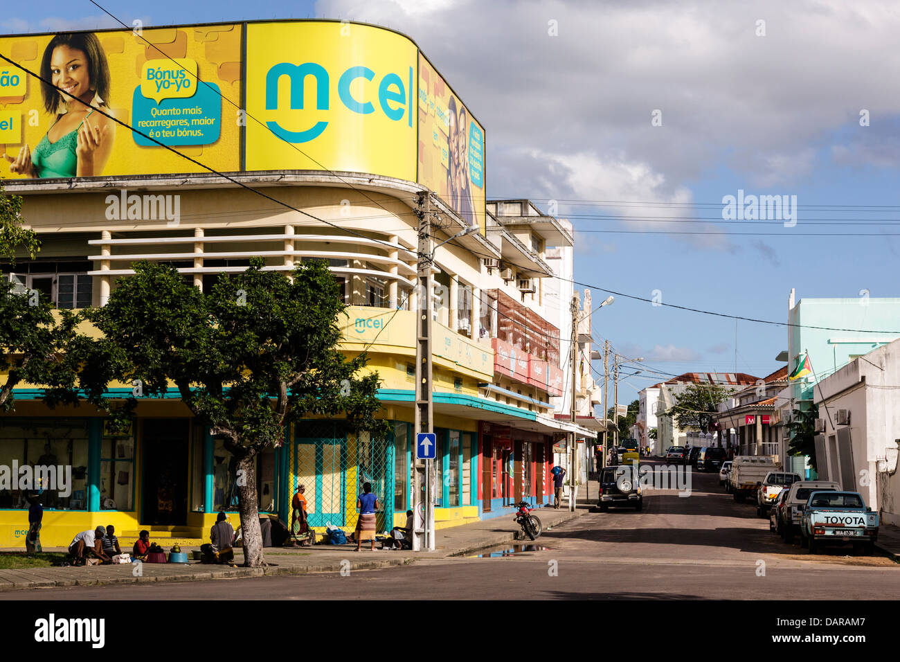 Africa, Mozambique, Inhambane. Cell phone commercial over street scene ...