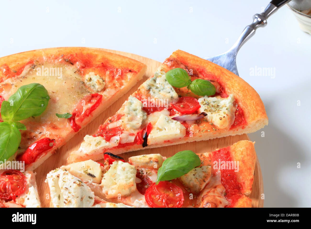 Fresh baked pizza quattro formaggi Stock Photo - Alamy