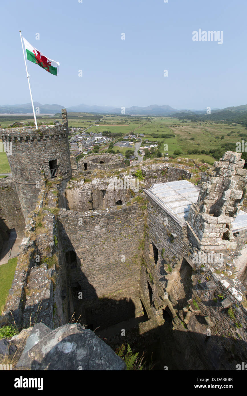 Town of Harlech, Wales. Harlech Castle gatehouse, with the Red Dragon ...