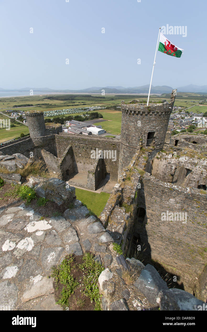 Town of Harlech, Wales. Harlech Castle gatehouse, with the Red Dragon ...